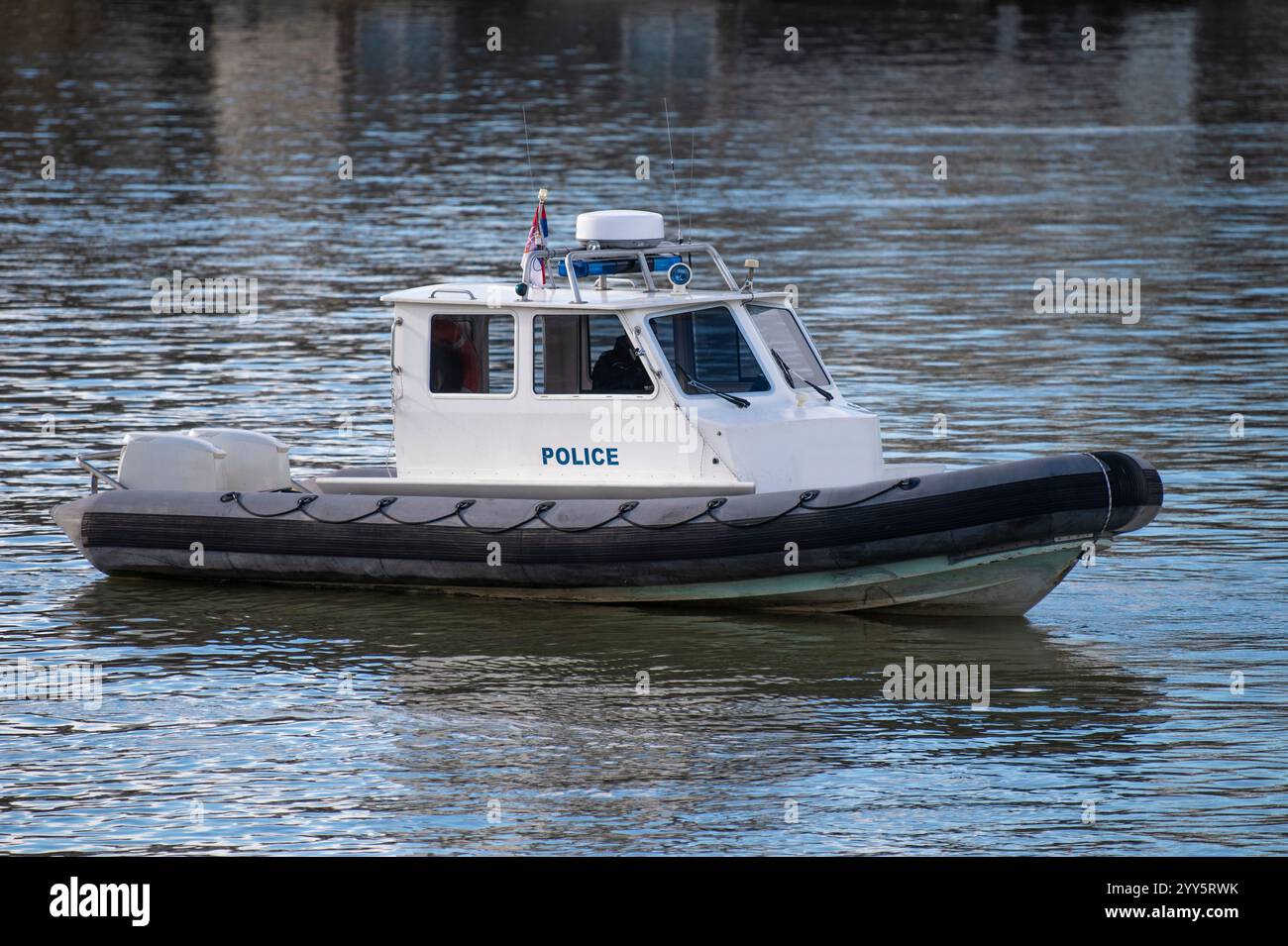 Police coast guard motor boat on water surface. Police patrol boat on ...