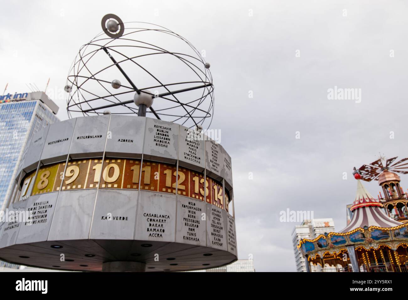 Berlin, Germany - December 15, 2019: World clock and christmas carousel ...