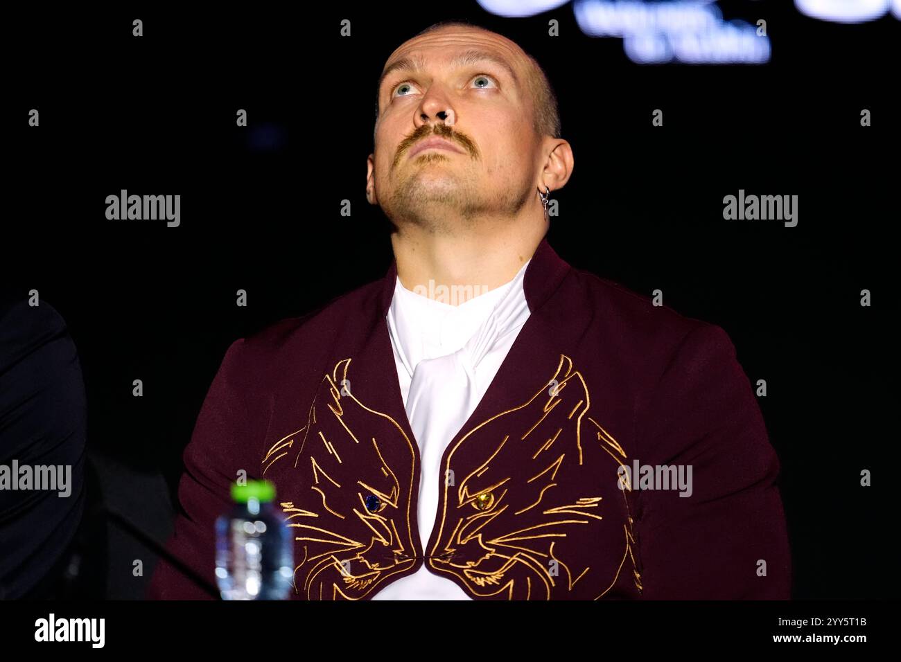 Oleksandr Usyk looks up during a press conference in Riyadh, Saudi ...