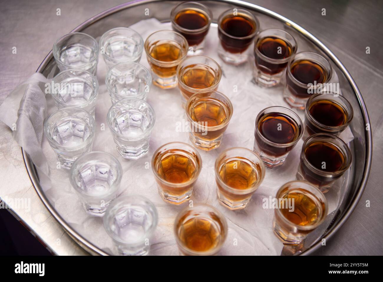 Lots of different kinds and colors of brandy cups (schnapps, rakija) on ...