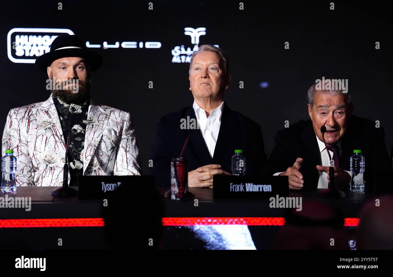 Boxer Tyson Fury (left), boxing promoter Frank Warren and Top Rank CEO ...