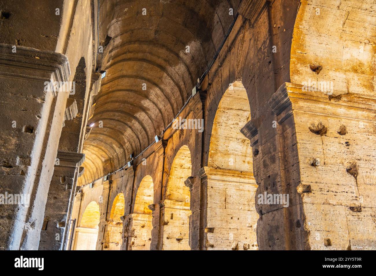 Visitors explore the interior of the Colosseum, admiring its impressive ...