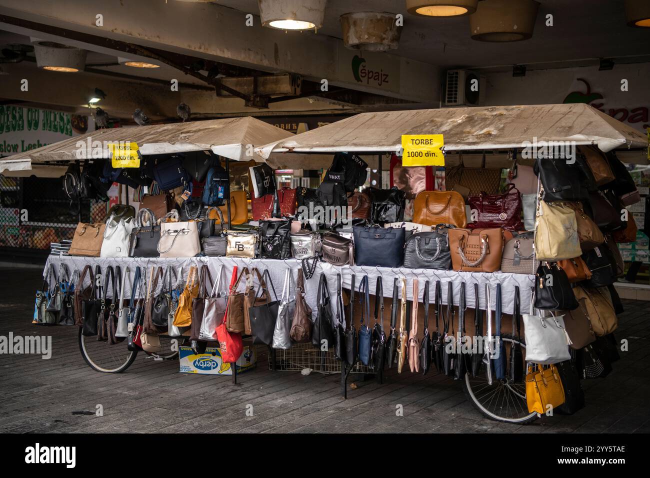 Vintage wooden mobile street market stand stall with wheels with pile ...