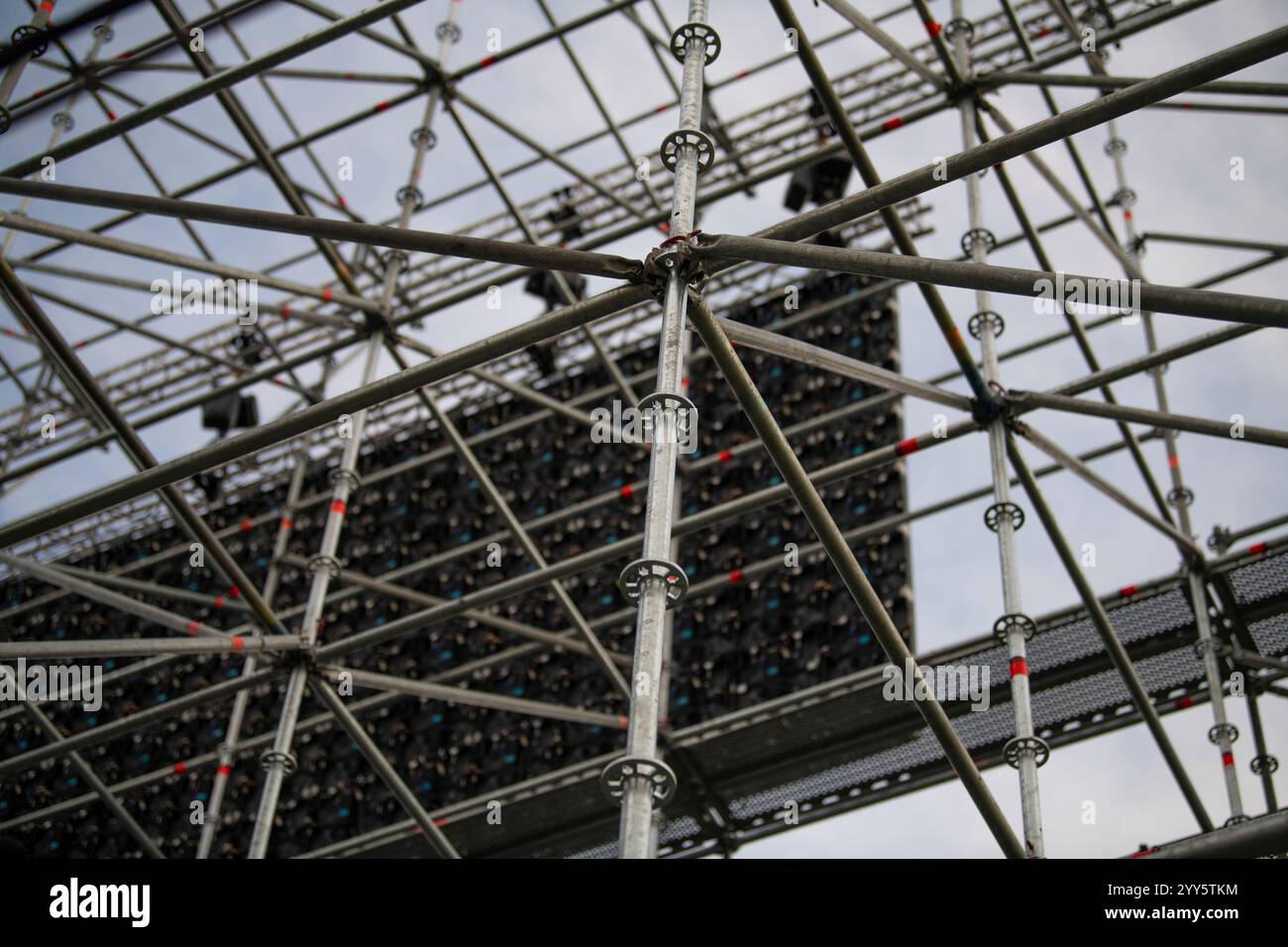 Closeup photo of stadium scaffolding construction behind huge led panel ...