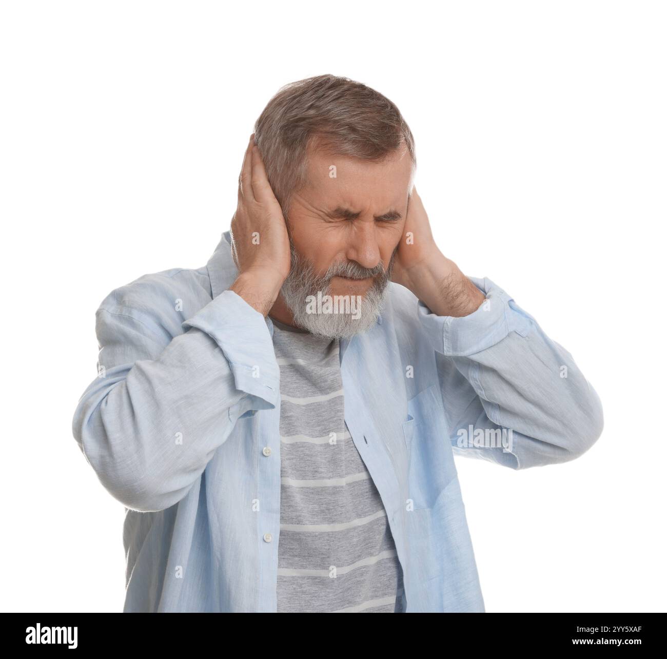 Senior man covering his ears on white background Stock Photo - Alamy