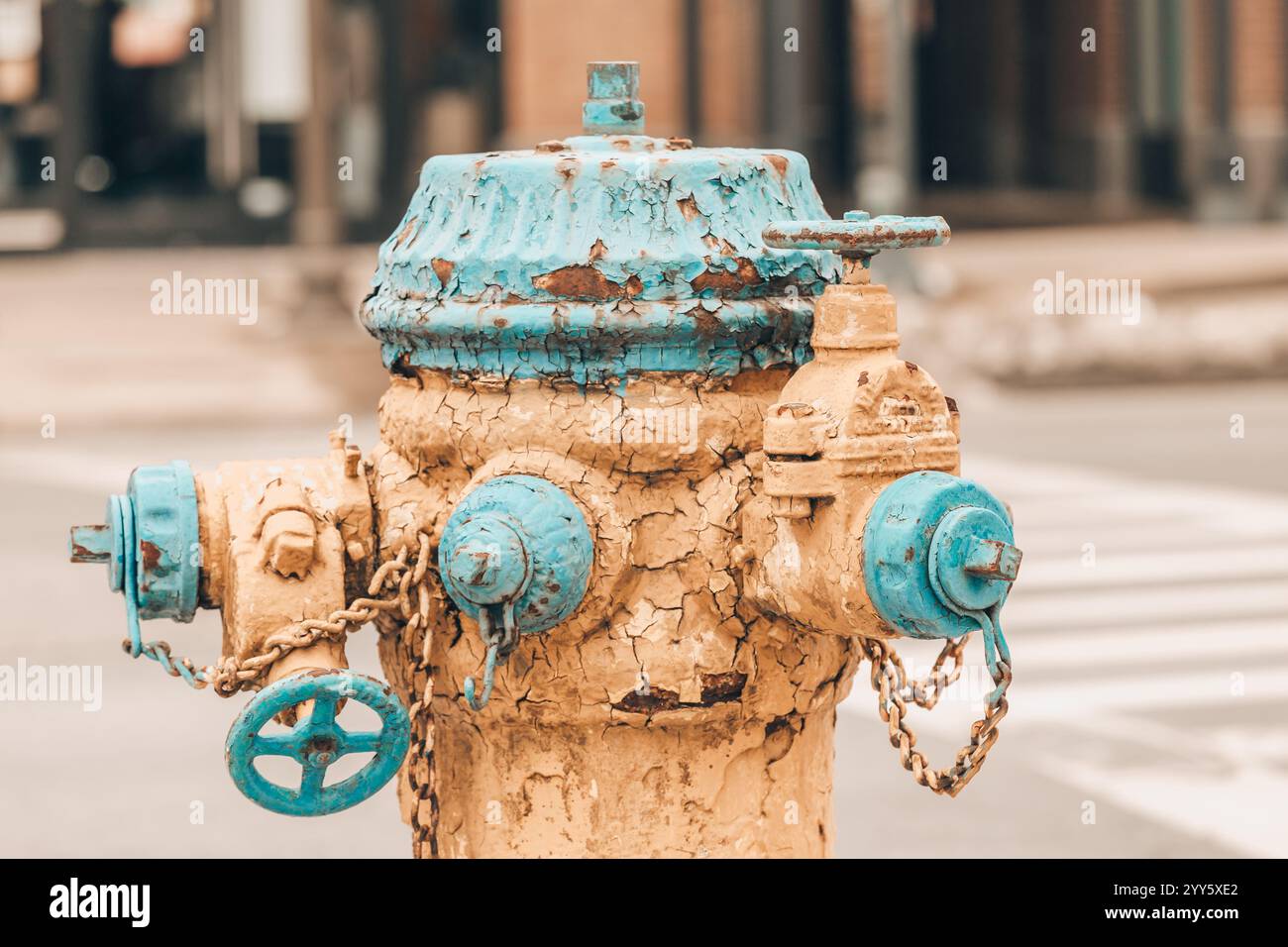 Yellow Water Fire Hydrant with Peeling Paint Stock Photo - Alamy