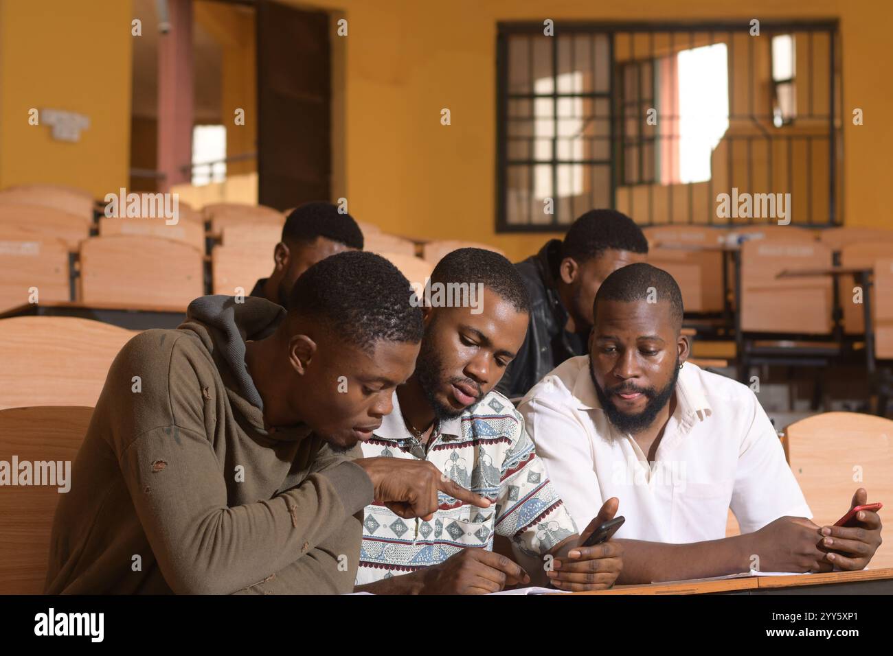 group of students in the classroom reading together happily Stock Photo ...