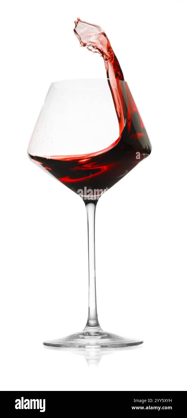 Red wine splashing in glass on white background Stock Photo - Alamy