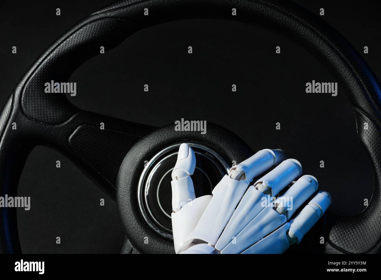 Artificial intelligence. Robot hand with steering wheel on black ...
