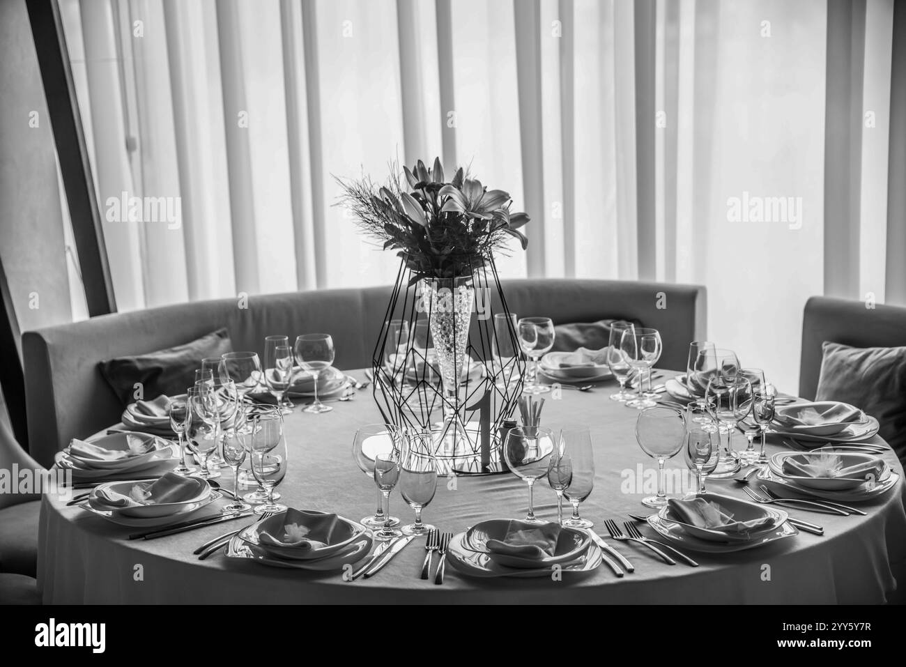 Luxury wedding banquet reception dinning table setup. The chairs and ...