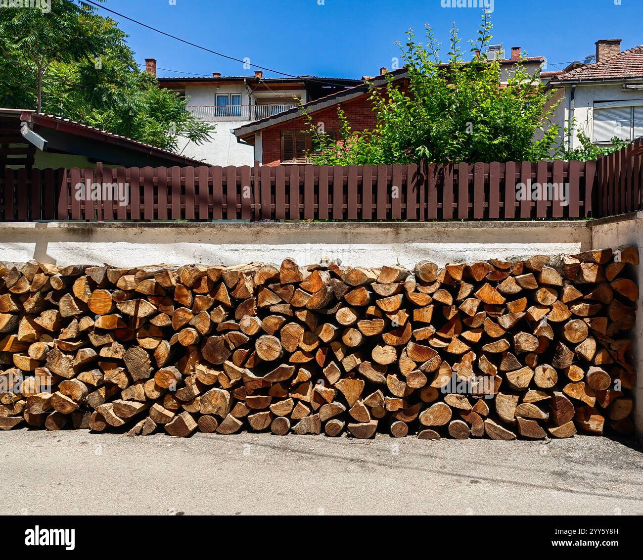 Stack of Firewood Against a Wall. A Rustic and Practical Background ...