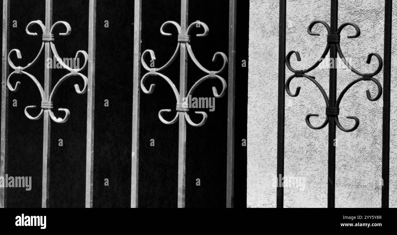 Wrought Iron Ornamented Entrance Against Sunlit Wall. A Study in ...