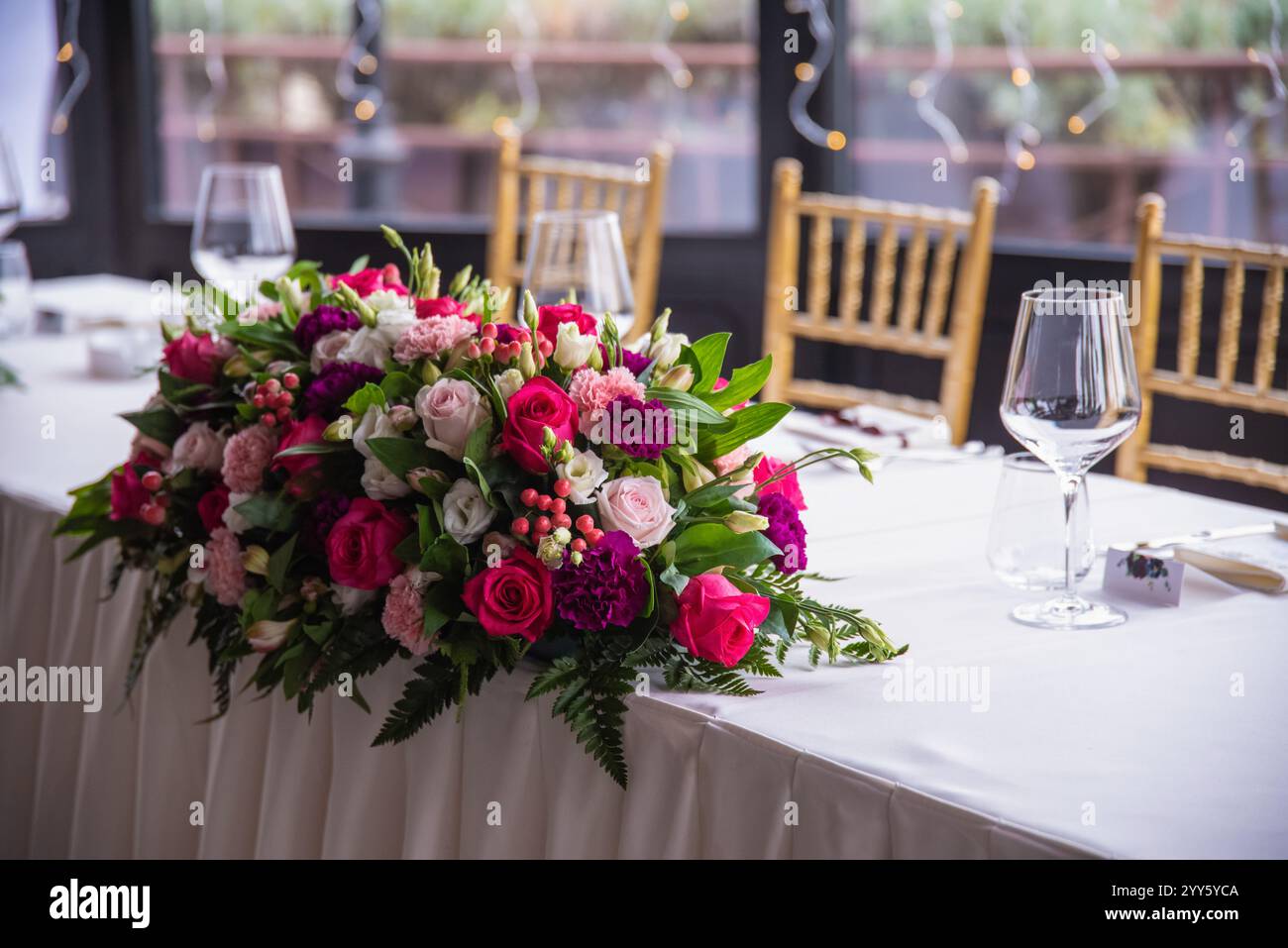 Luxury wedding banquet reception dinning table setup. The chairs and ...