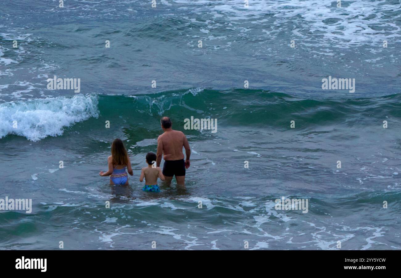 Spring family bathing in the Atlantic ocean, San Sebastian, Spain Stock ...