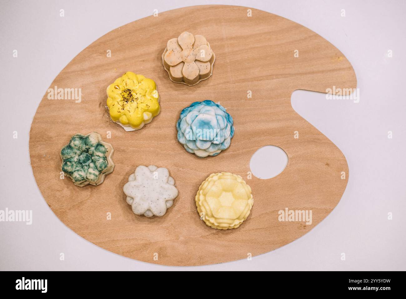 Top view of bars of beautiful, fragrant and colorful homemade soaps on ...
