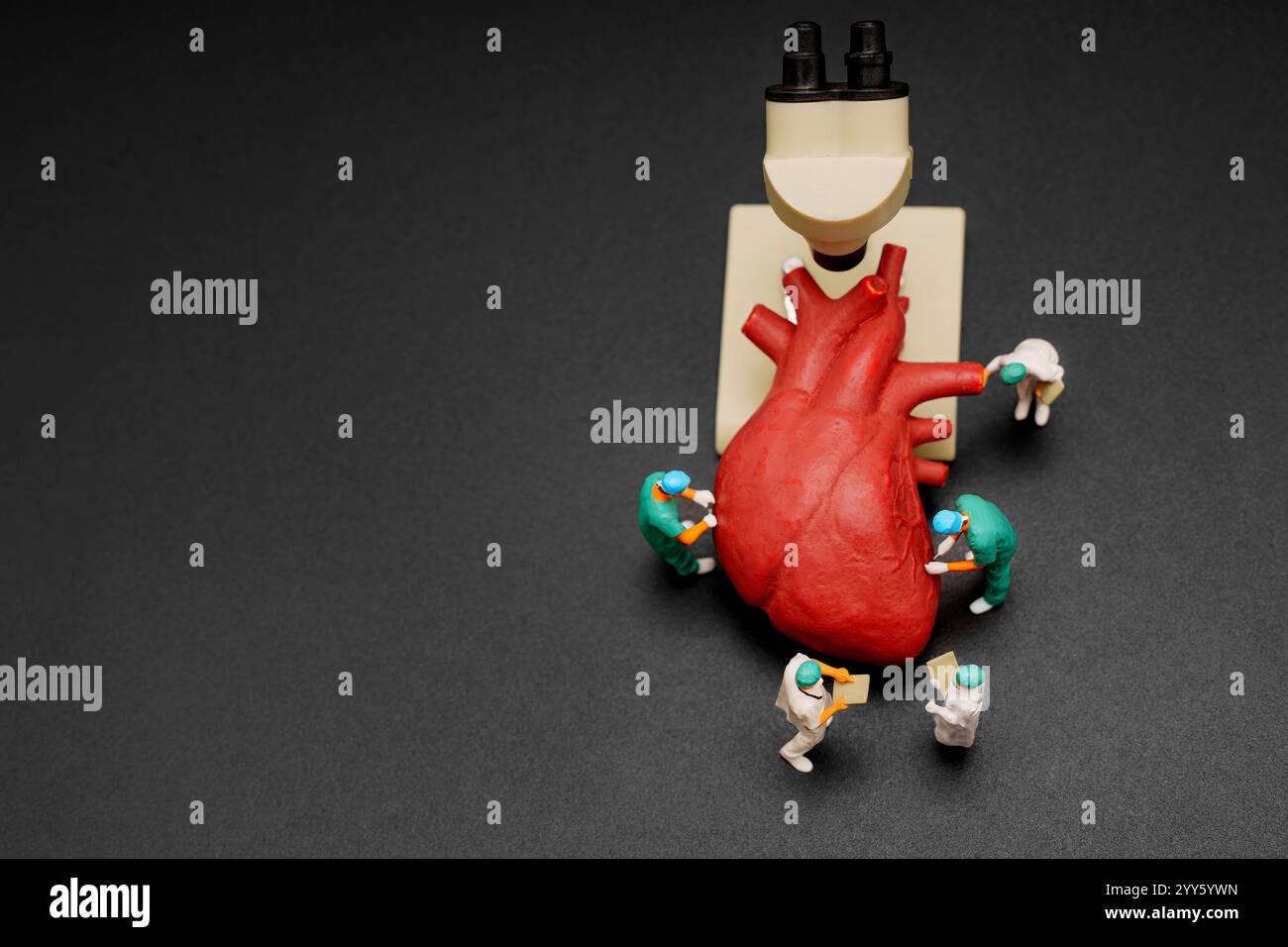 Miniature figurines interact with a heart model and microscope ...