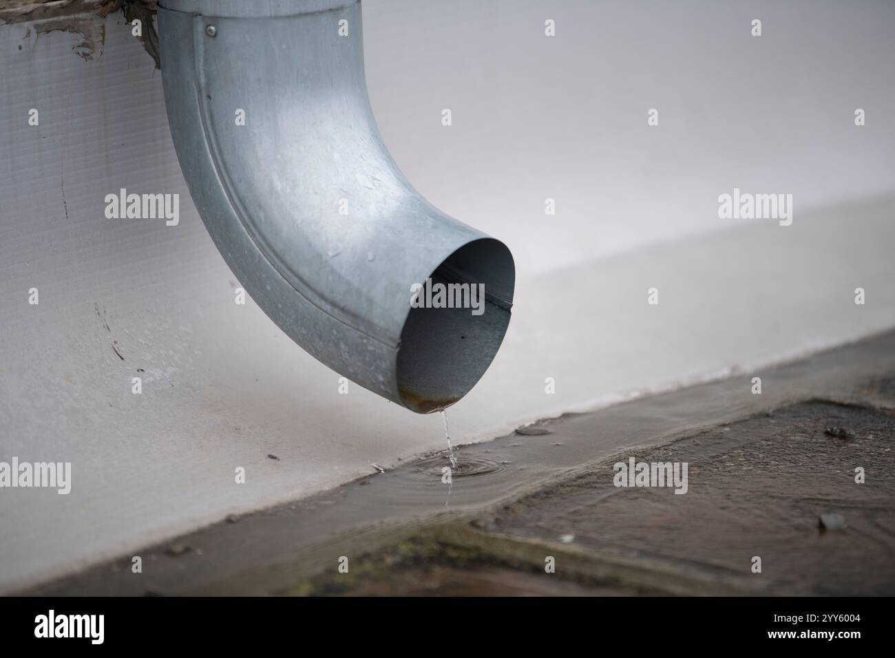 Rain water flowing from metal downspout. Aluminium gutter box water ...
