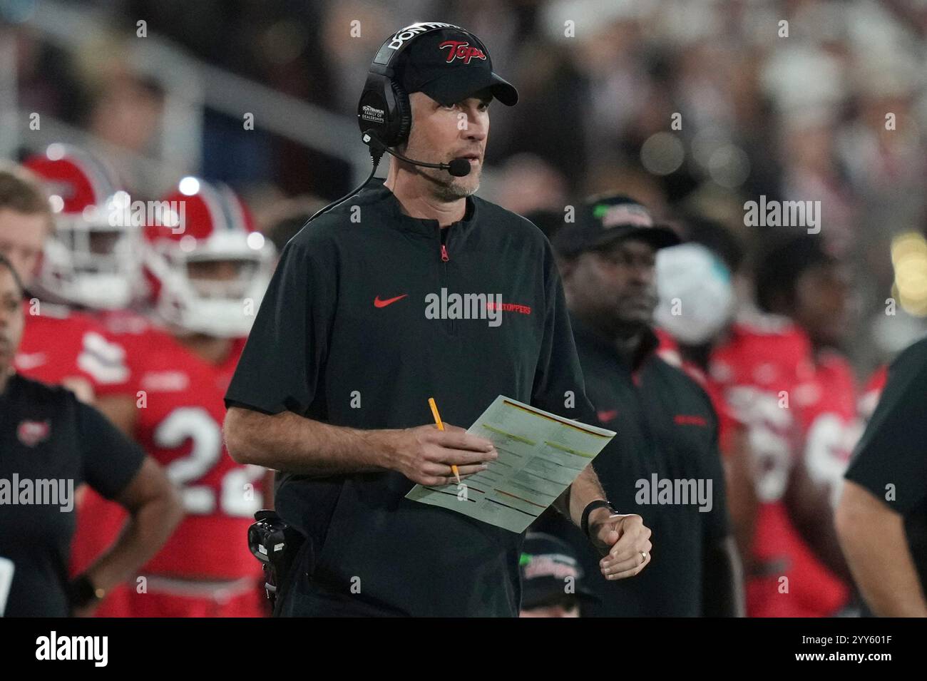 Western Kentucky head coach Tyson Helton watches during the first half ...