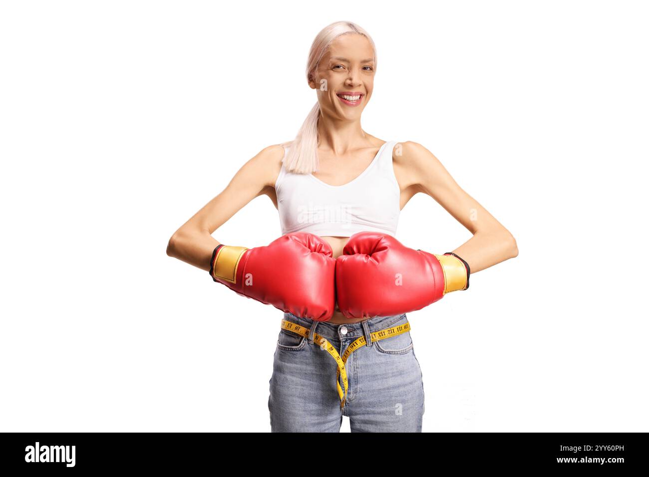 Slim woman with boxing gloves smiling isolated on white background ...