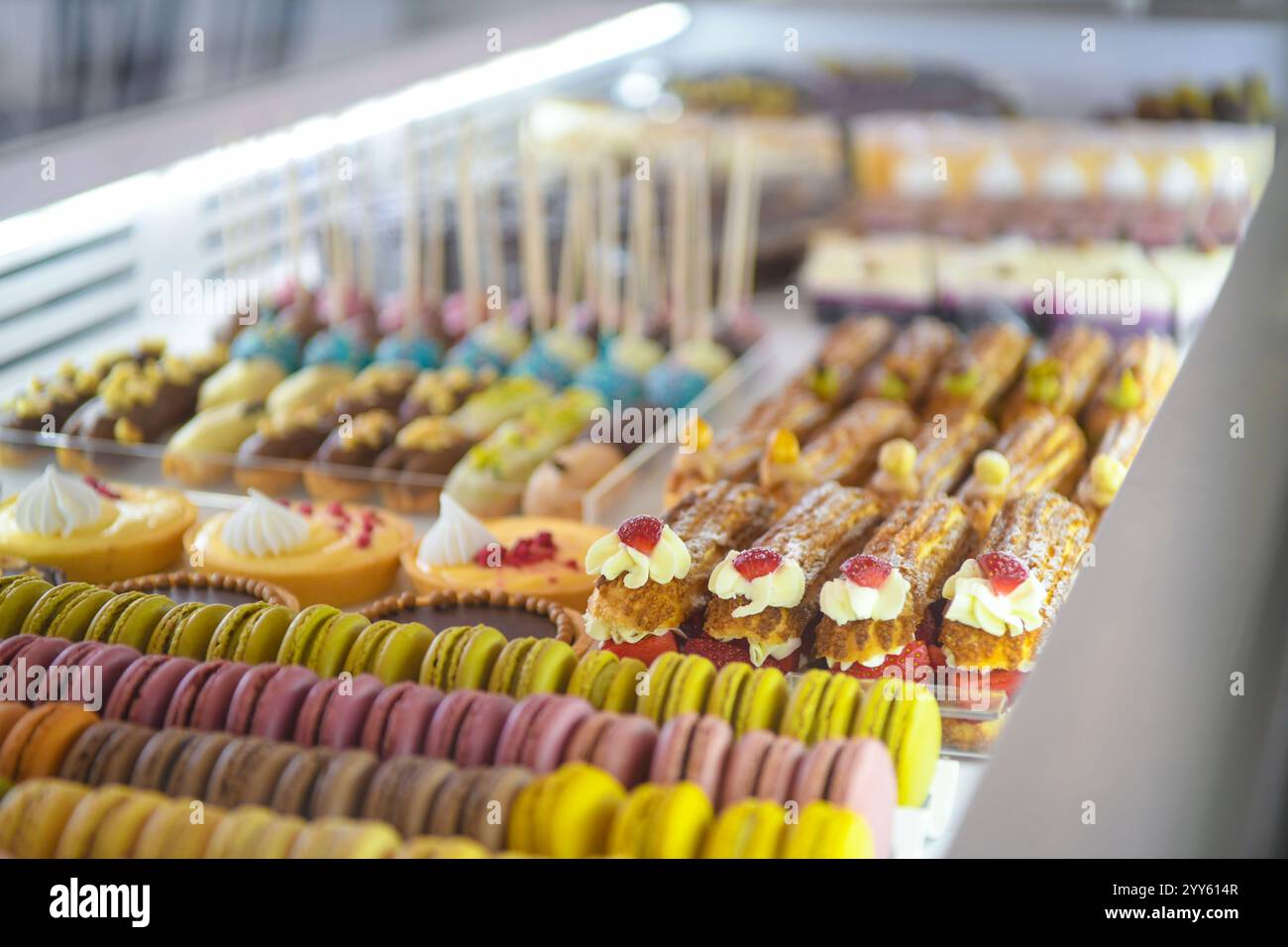 Pastry shop glass display with selection of sweets and cakes ...
