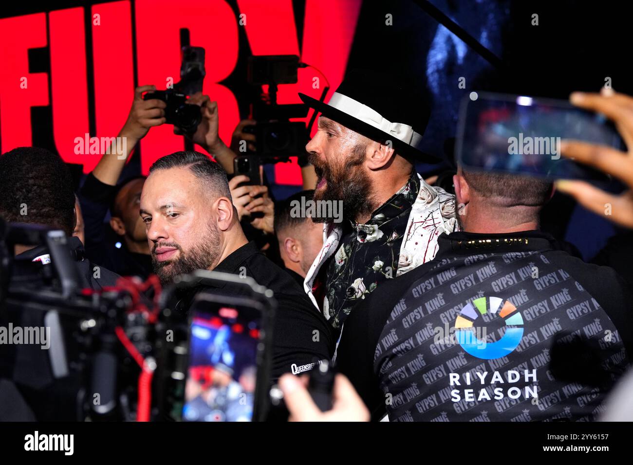 Tyson Fury (centre) reacts during a face off with Oleksandr Usyk (not ...