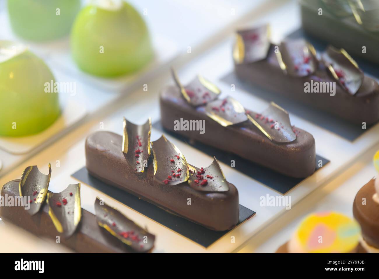 Pastry shop glass display with selection of sweets and cakes ...
