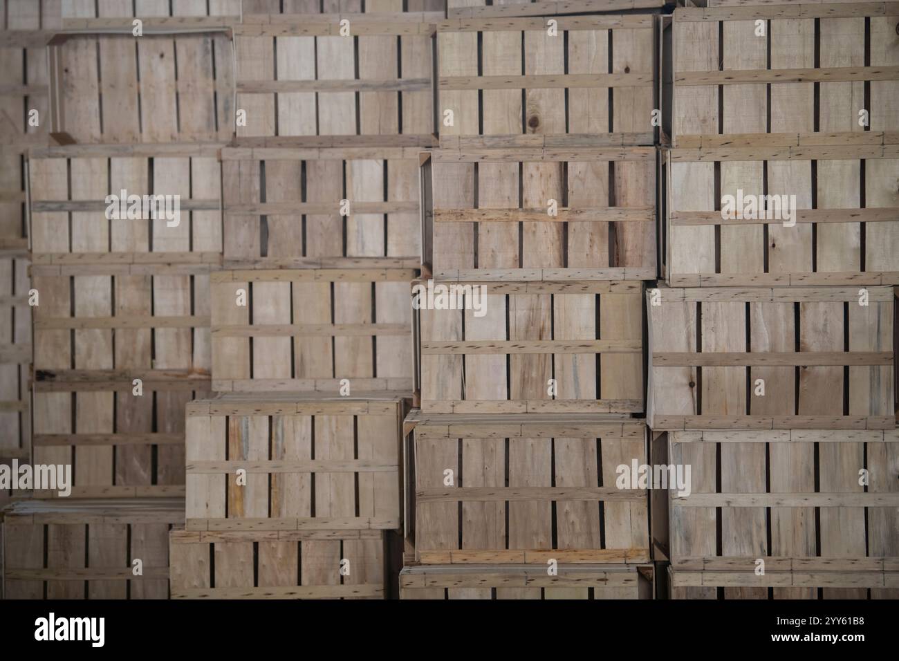 Stack of empty wooden crates or boxes for fruits and vegetables at the ...