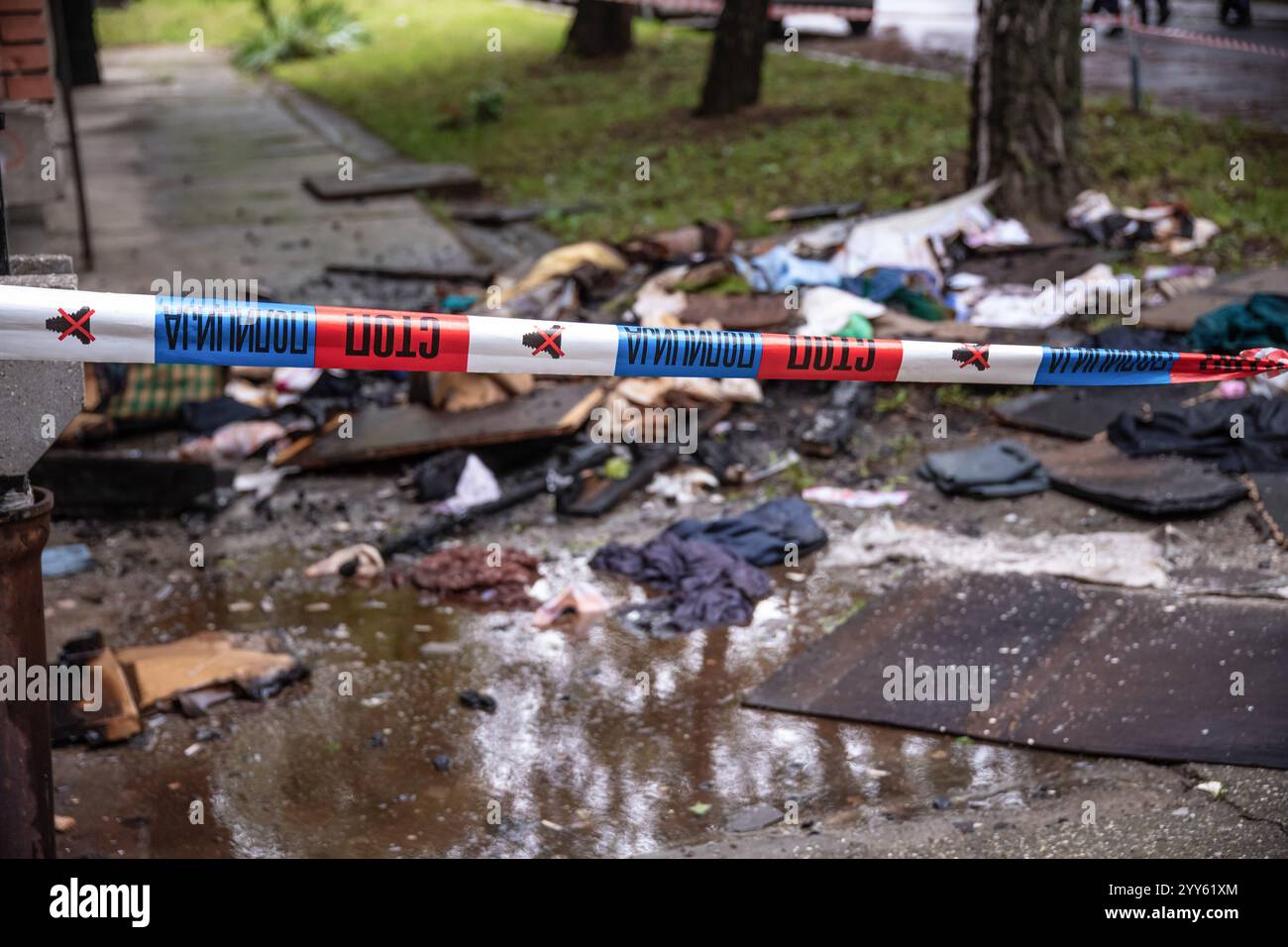 Police crime scene investigation tape on a place where apartment burned ...