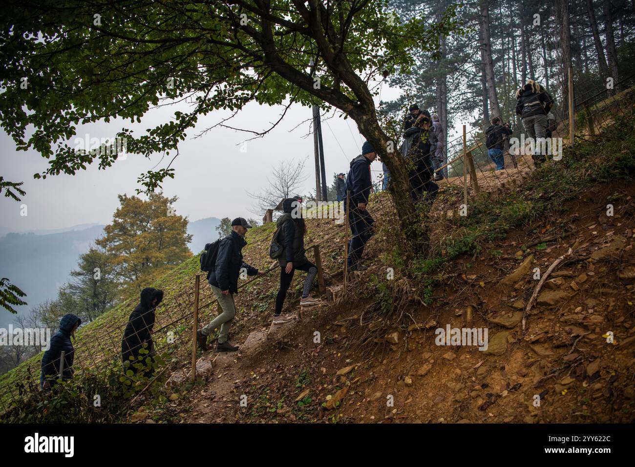 Tourists climb the stairs leading to the Pyramid of the Sun, known for ...