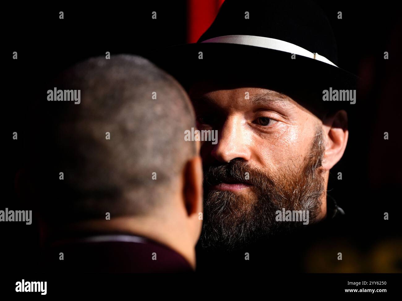 Tyson Fury (right) and Oleksandr Usyk face off during a press ...