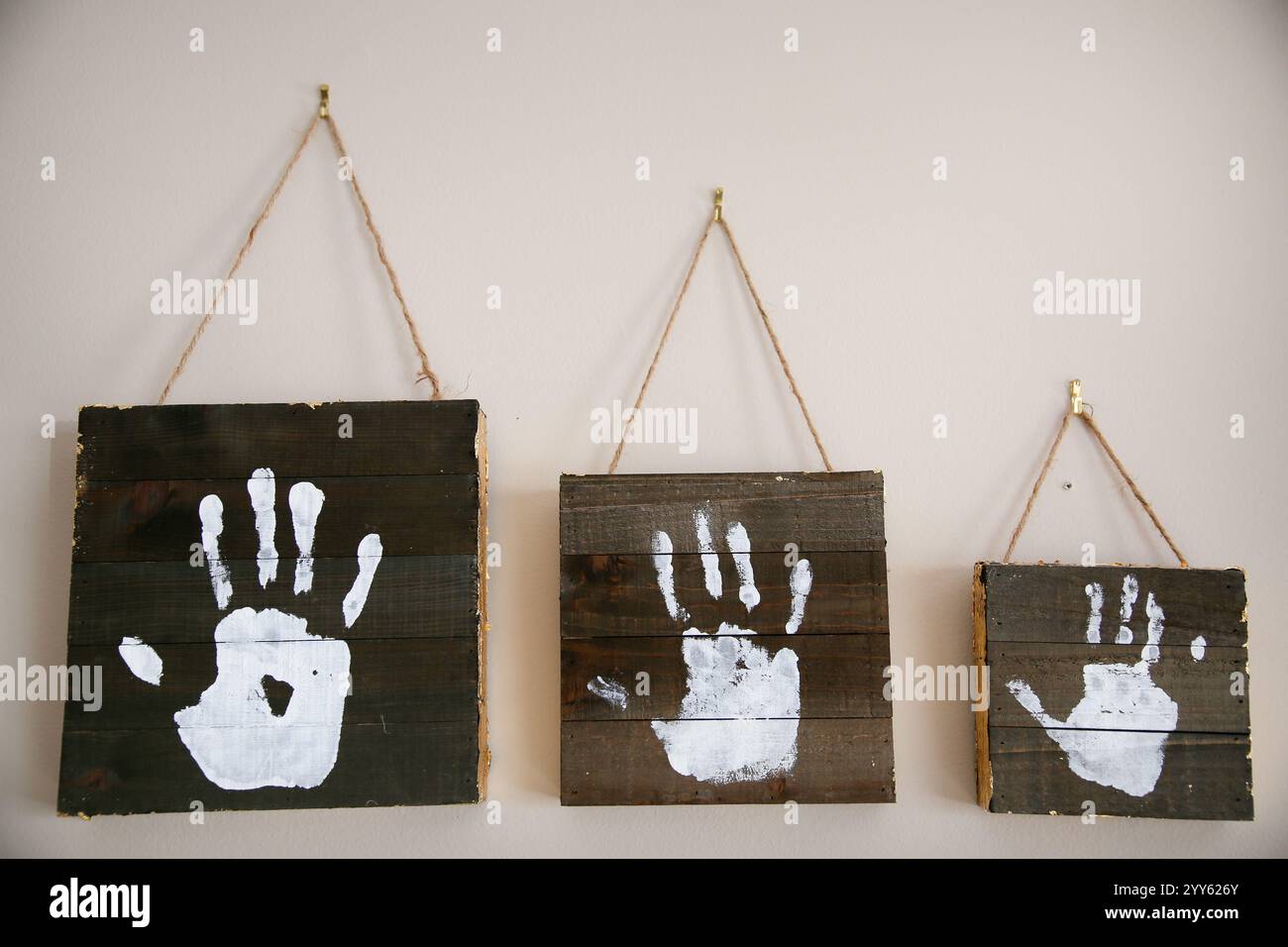 Family Handprints Decoration on Wall Stock Photo - Alamy