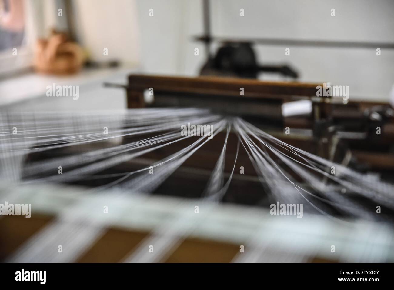 A traditional weaving workshop Factory with old manual wooden loom ...