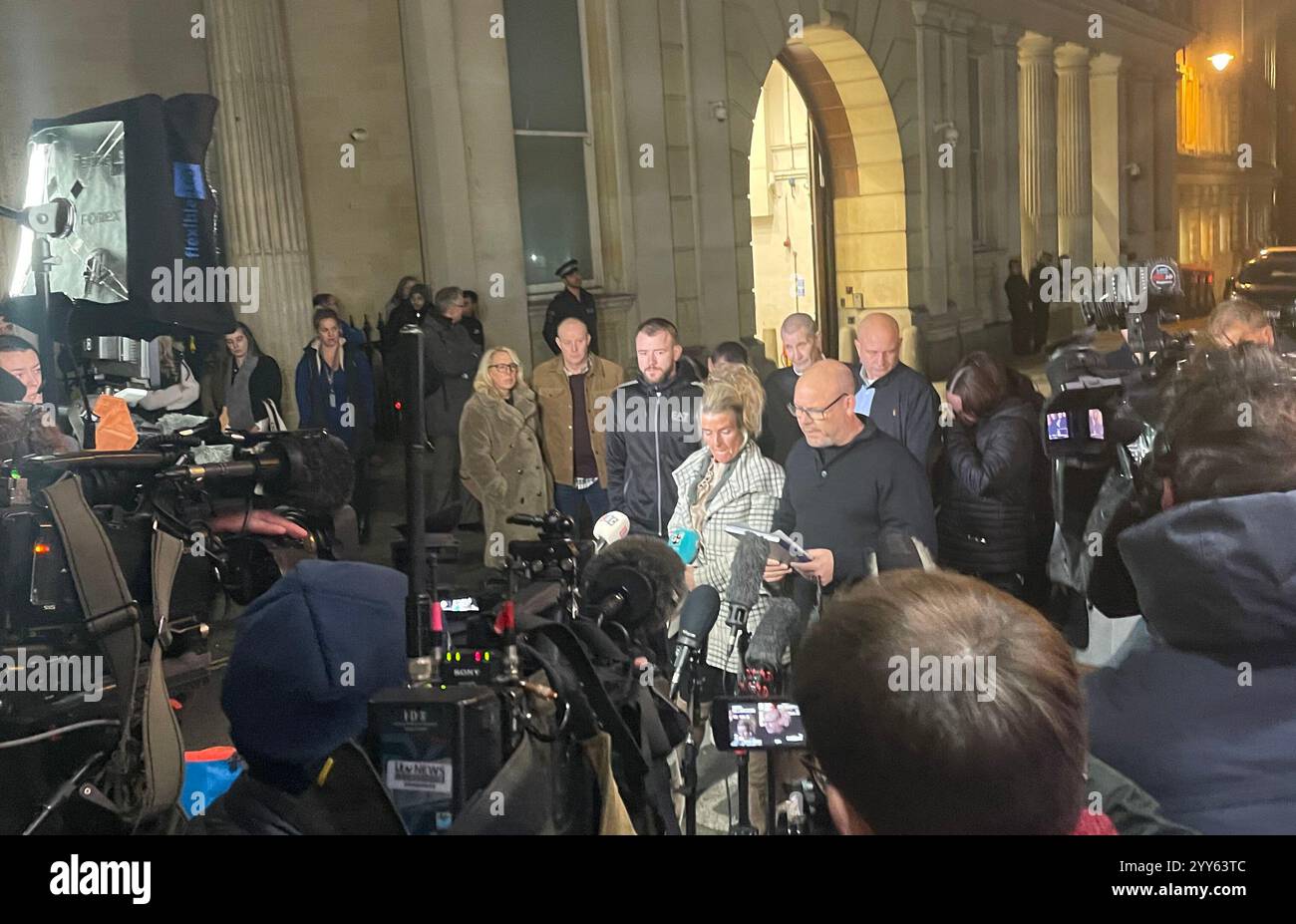 Family and police speaking to the media outside Bristol Crown Court ...