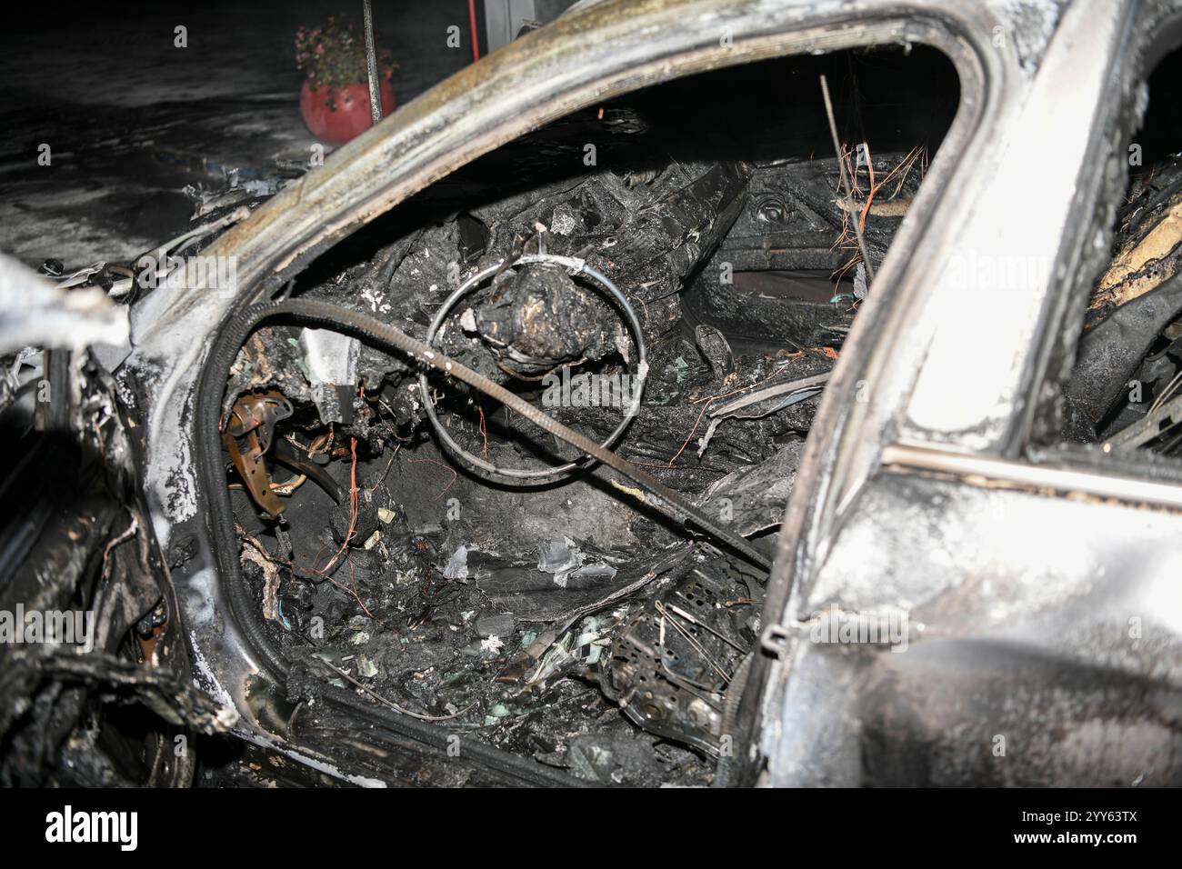 Car exploded and destroyed on fuel pump in accident. Closeup view of ...