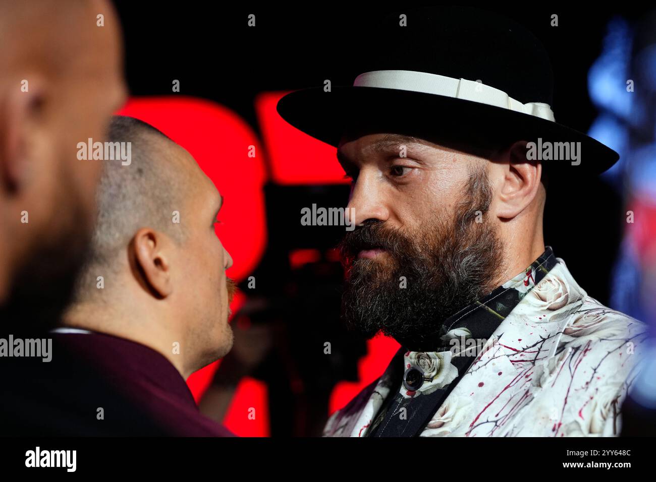 Tyson Fury (right) and Oleksandr Usyk face off during a press ...