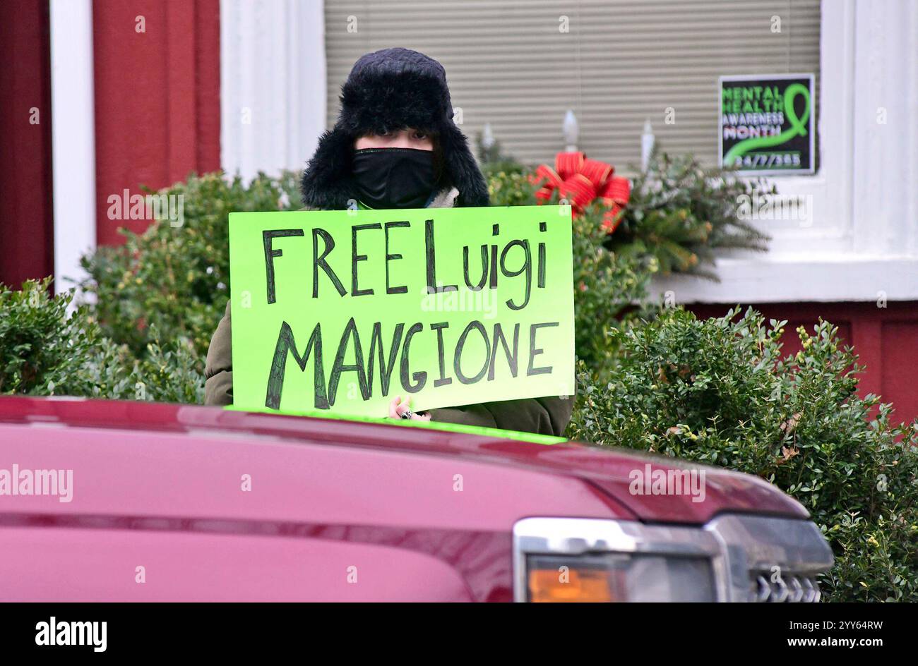 An unidentified woman protests for the release of Luigi Nicholas ...