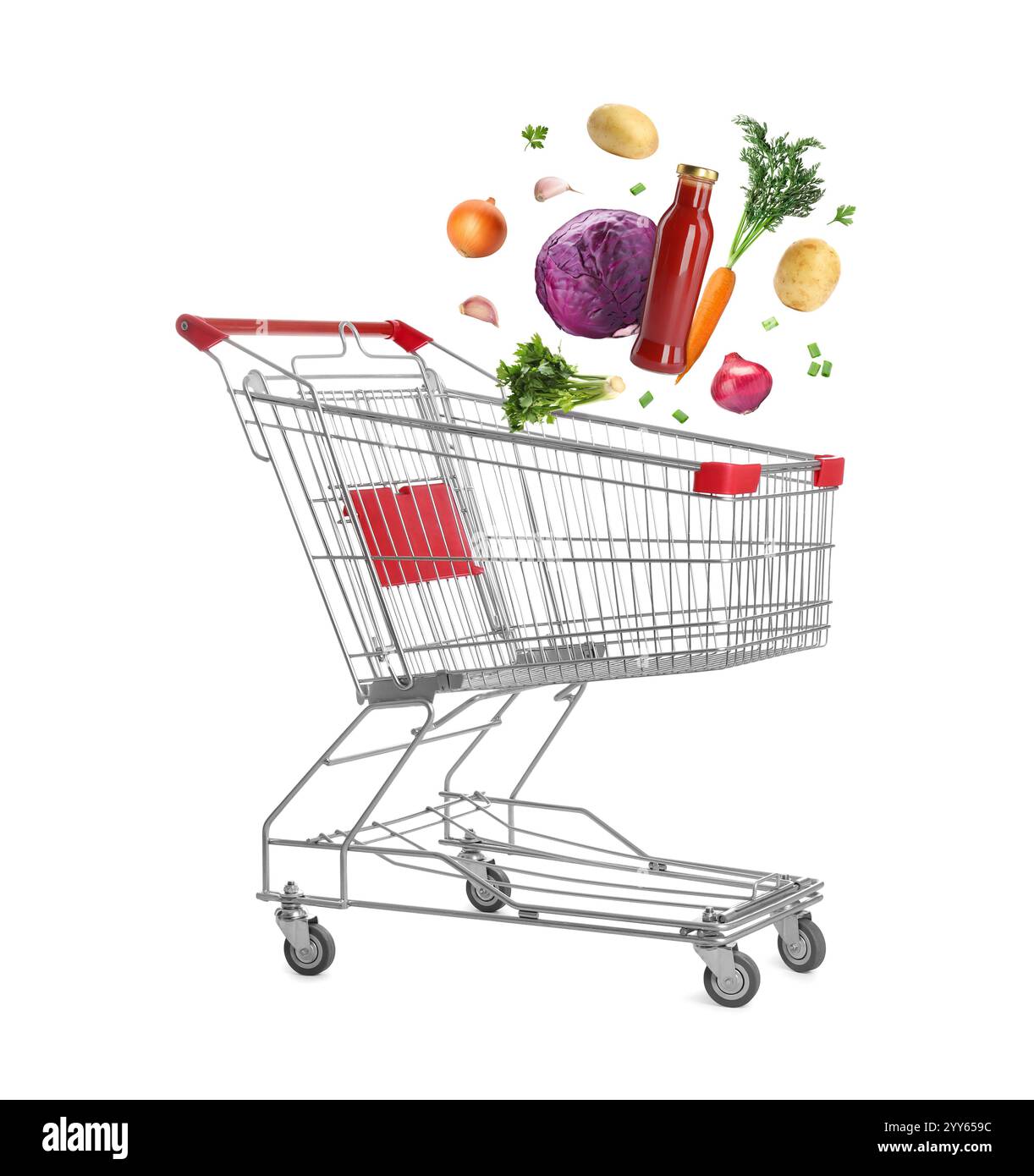 Groceries falling into shopping cart on white background Stock Photo ...