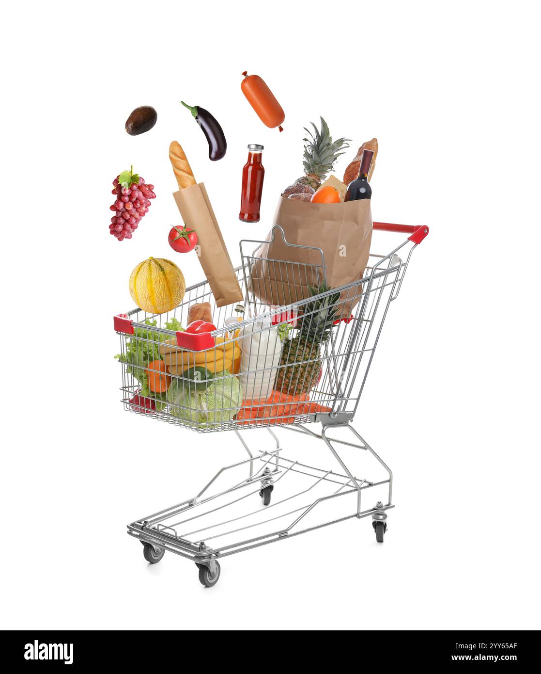 Groceries falling into shopping cart on white background Stock Photo ...