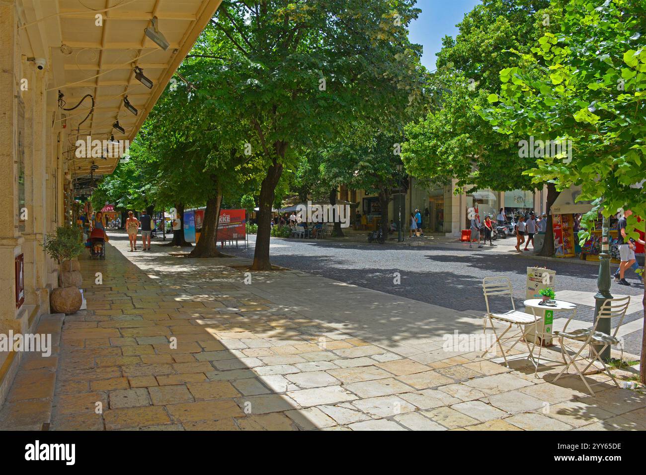 Corfu, Greece - June 6th 2024. Trees provide shade in Corfu Old Town. A ...
