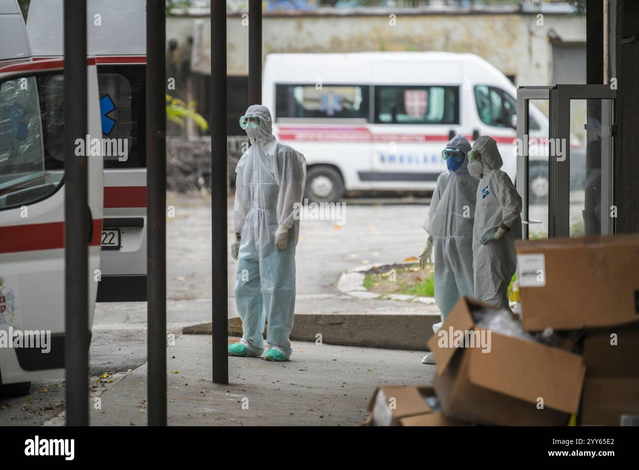 Paramedics in protective suit bring medical ventilator intensive care ...