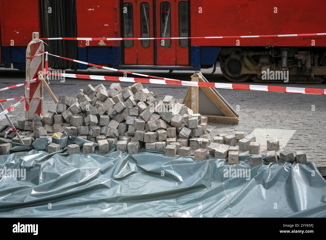 Pellet with many small granite block cobblestone paving stones, stacked ...
