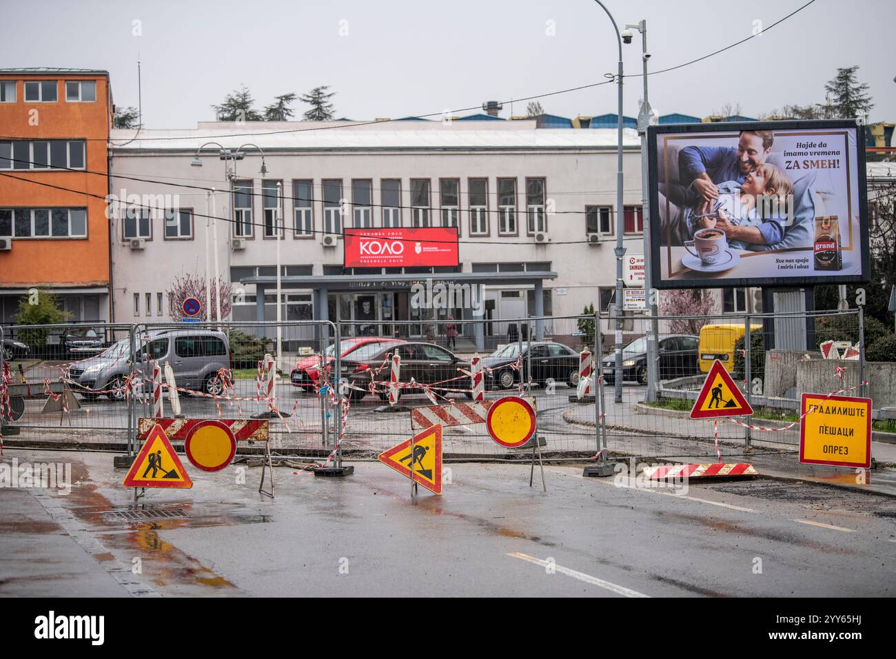 Inner city road closed by signs and boundary around street works ...
