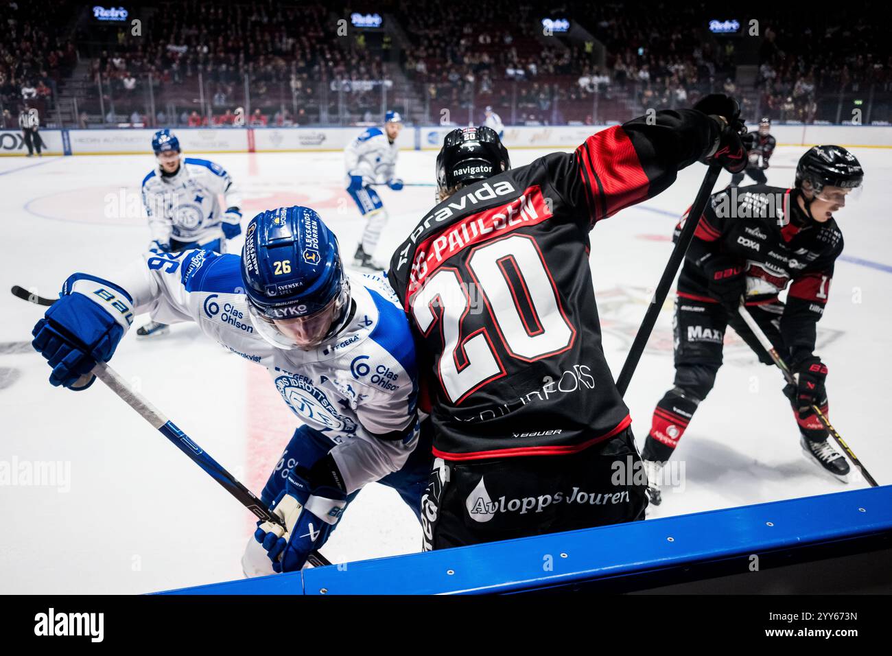 241219 Leksands Patrik Norén och Malmö Redhawks Thomas Berg Paulsen under ishockeymatchen i SHL ...