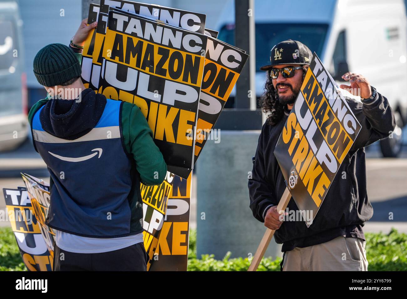 Amazon workers strike outside the gates of an Amazon Fulfillment Center ...