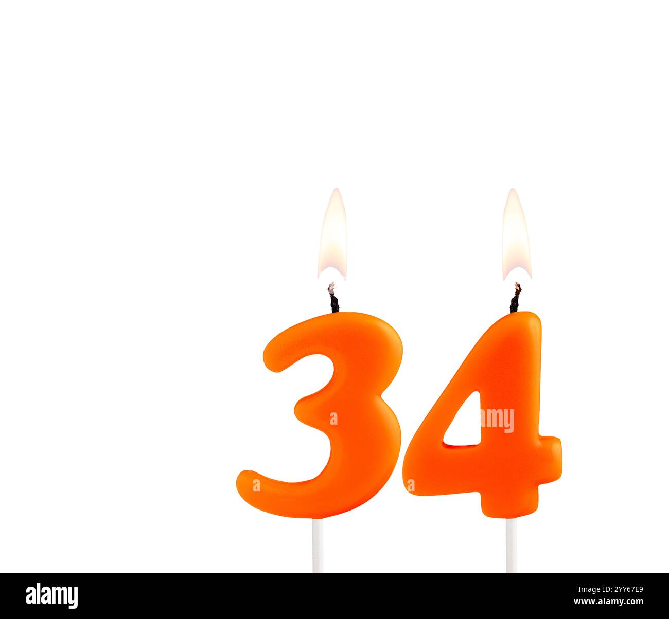 Orange birthday candle on white background - Number 34 Stock Photo - Alamy