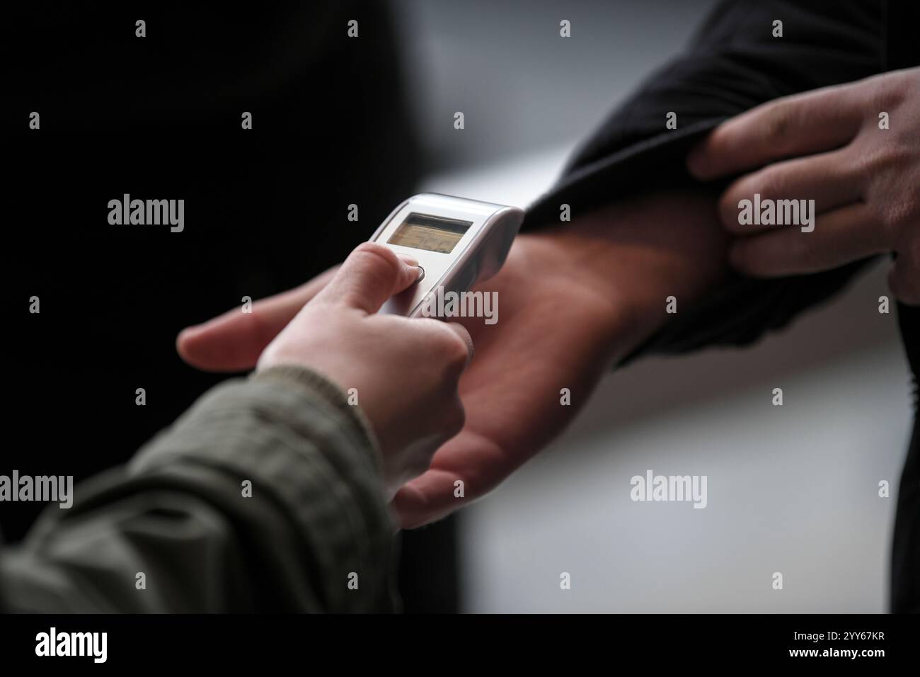 Visitors must go through fever measures using infrared digital ...