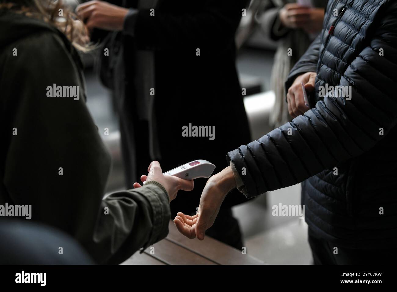 Visitors must go through fever measures using infrared digital ...