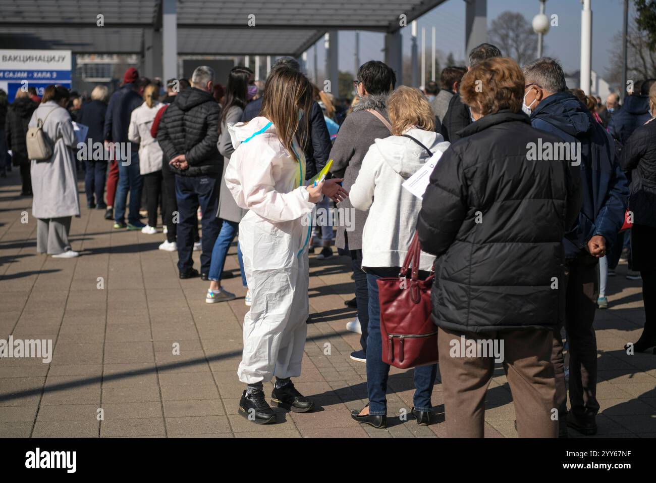 People stand in long queues on Belgrade fair in front of the checkpoint ...