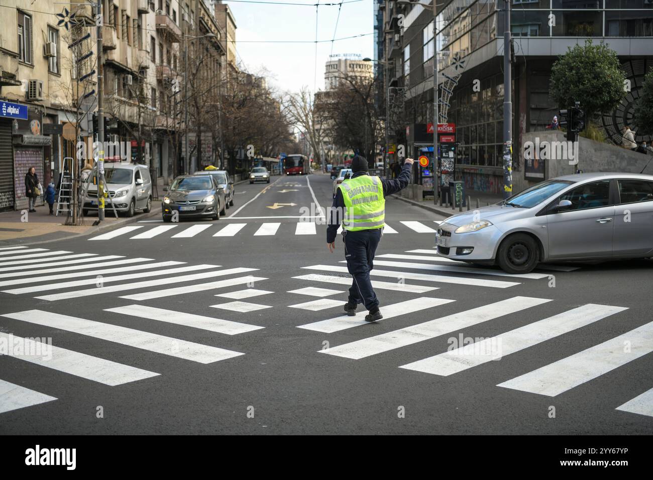 A Police officer controls the intersection, Pedestrian crossing, New ...