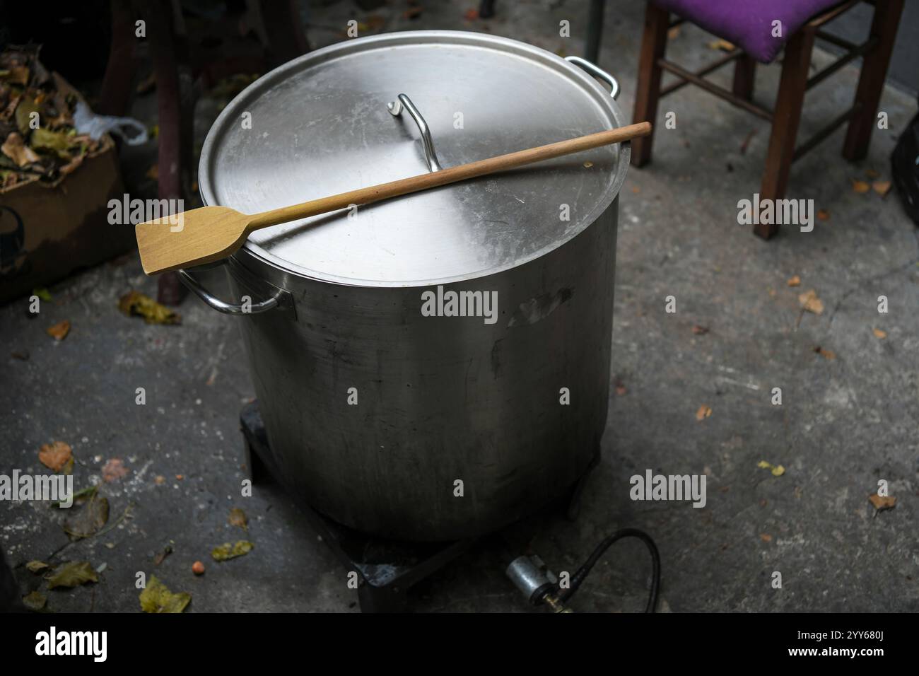 Large aluminium pot with the gas cylinder in the camp kitchen ...